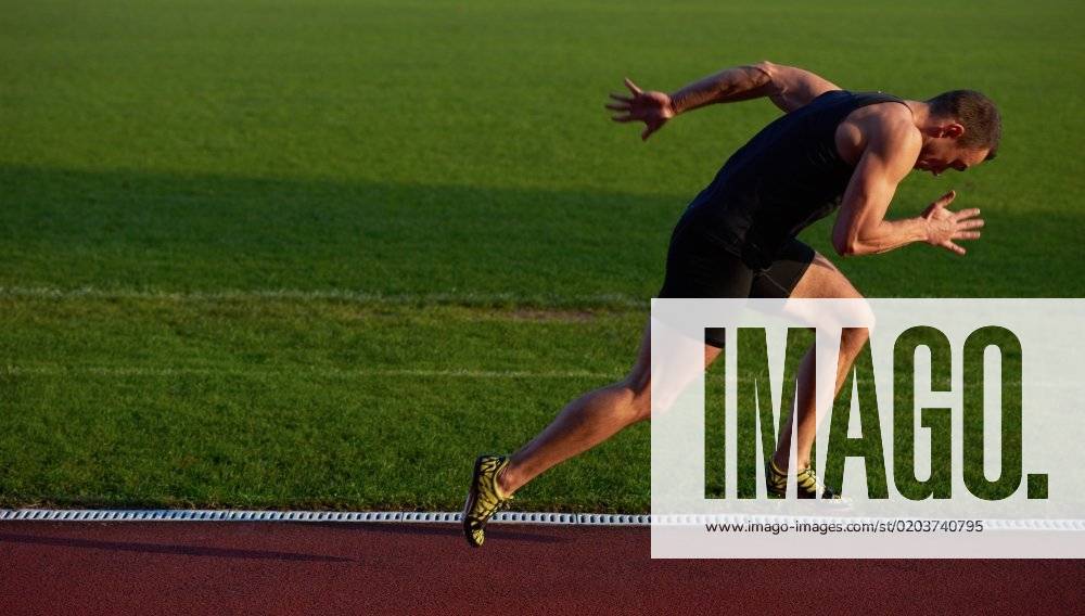Sprinter leaving starting blocks on the running track. Explosive