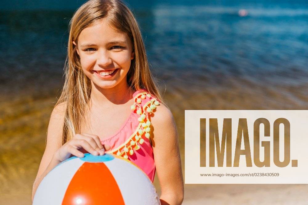 Smiling cute girl with beach