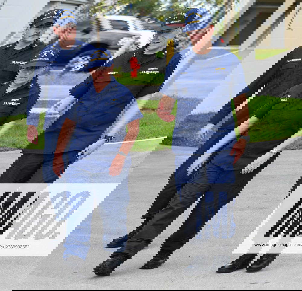 Rear Adm. John W. Mauger, commander, 1st District (right), discusses ...