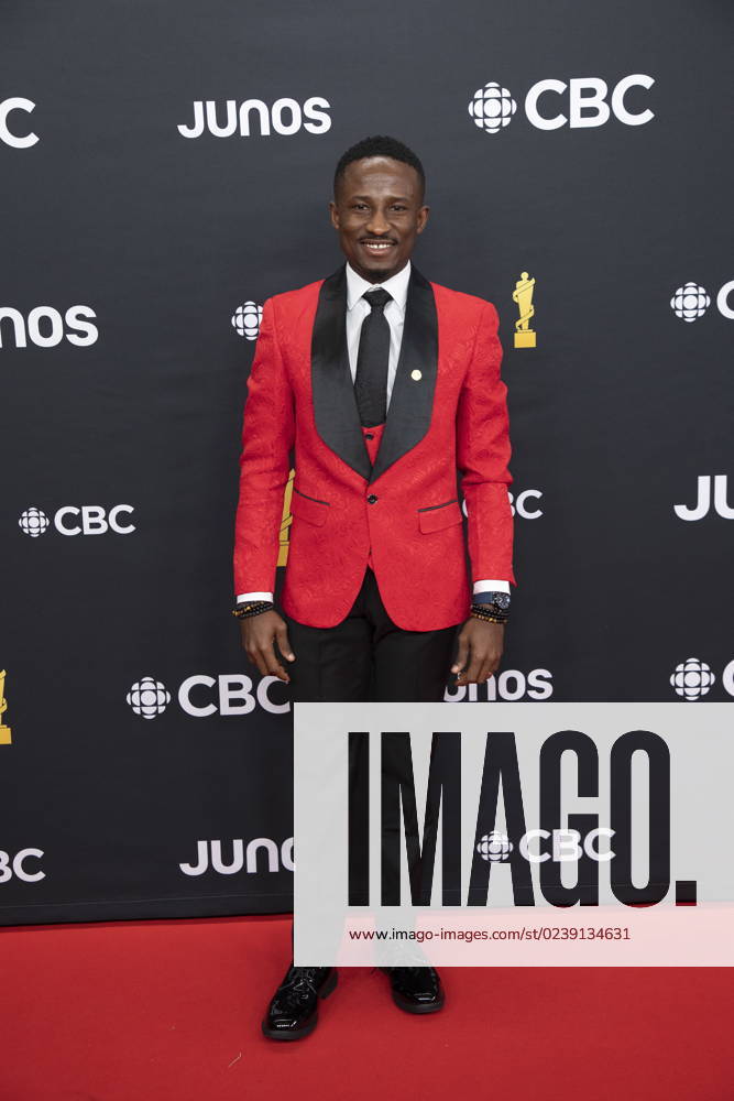EDMONTON, AB, CANADA: Daniel Ojo arrives on the red carpet for the Juno ...