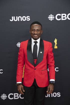 EDMONTON, AB, CANADA: Daniel Ojo arrives on the red carpet for the Juno ...