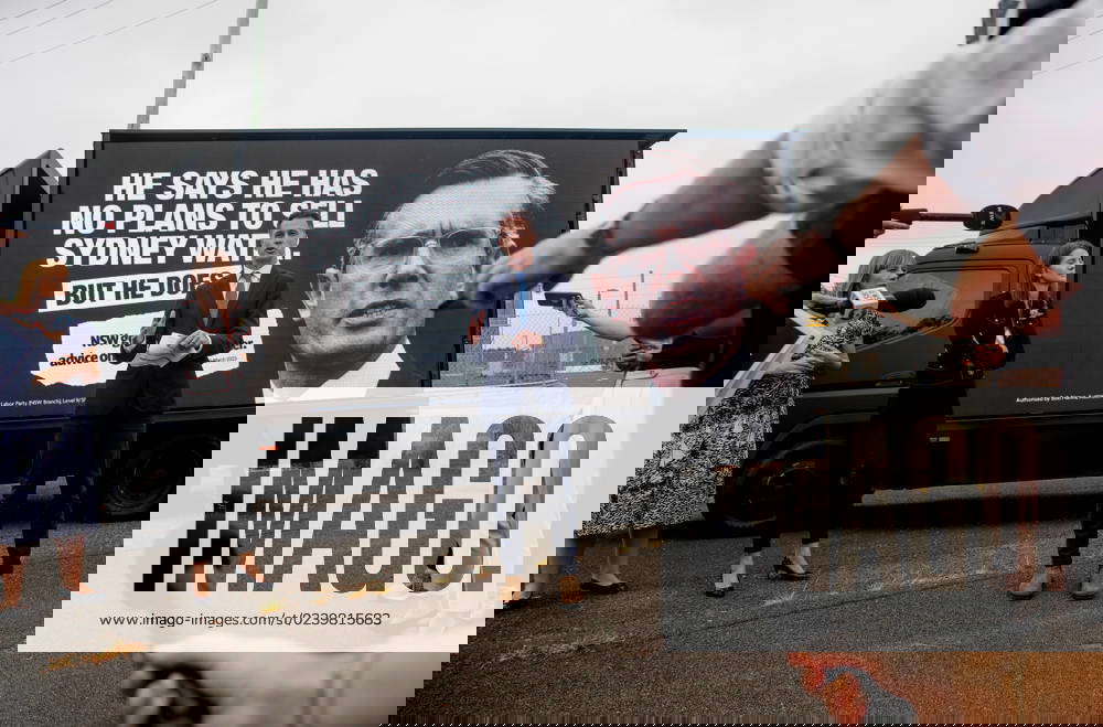 NSW LABOR CAMPAIGN, NSW Labor Leader Chris Minns next to a billboard ...