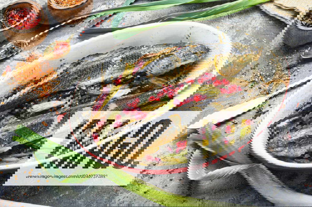 Pelengas fish baked with vegetables and pomegranate.Tasty baked whole ...