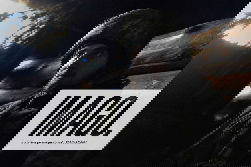 March 29, 2023, Kyiv, Kyiv, Ukraine: Yuzik, a Ukrainian soldier sits inside his position along the