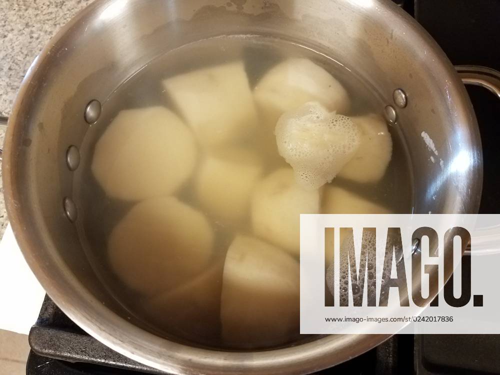 Puerto Rican root vegetable in pot of water on stove , 30084766, root ...