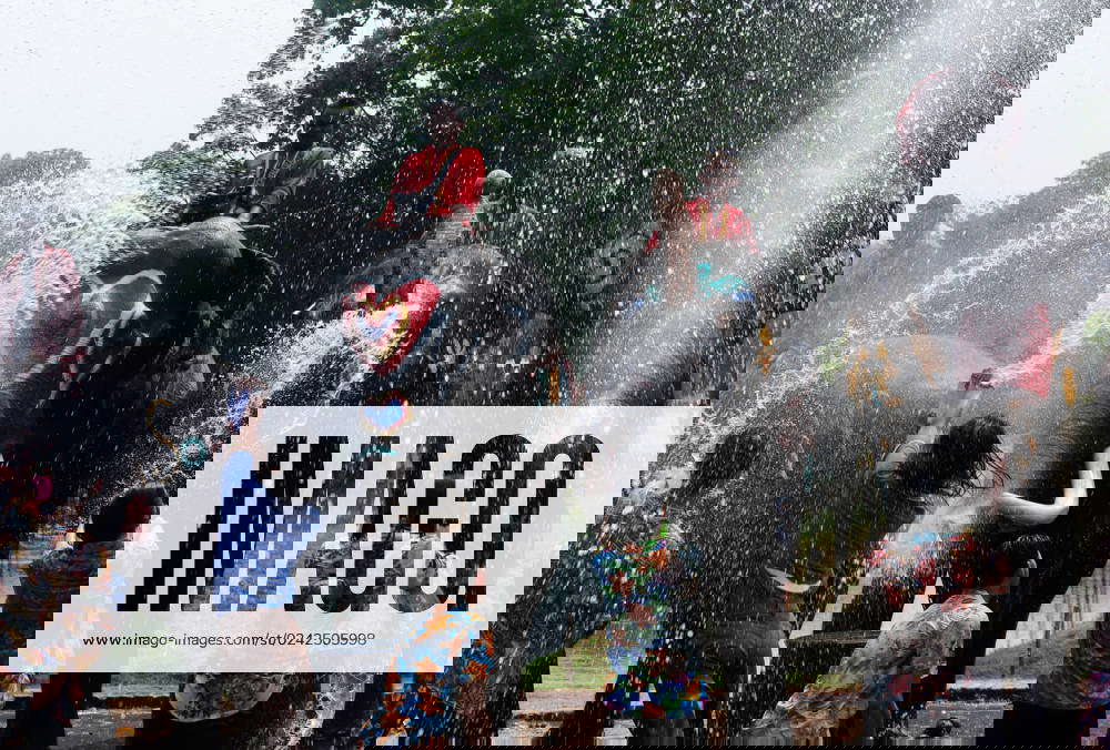 April 11, 2023, Ayutthaya, Thailand: Elephants splash tourists with water in celebration of the