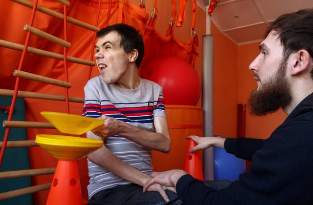 RUSSIA, MOSCOW - : Care recipient Sergei and care recipient Nastya with ...