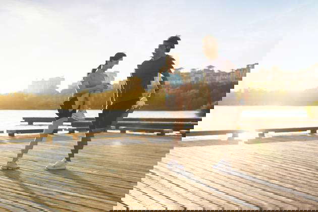 Happy mature Chinese couple having a rest after exercising Beijing China