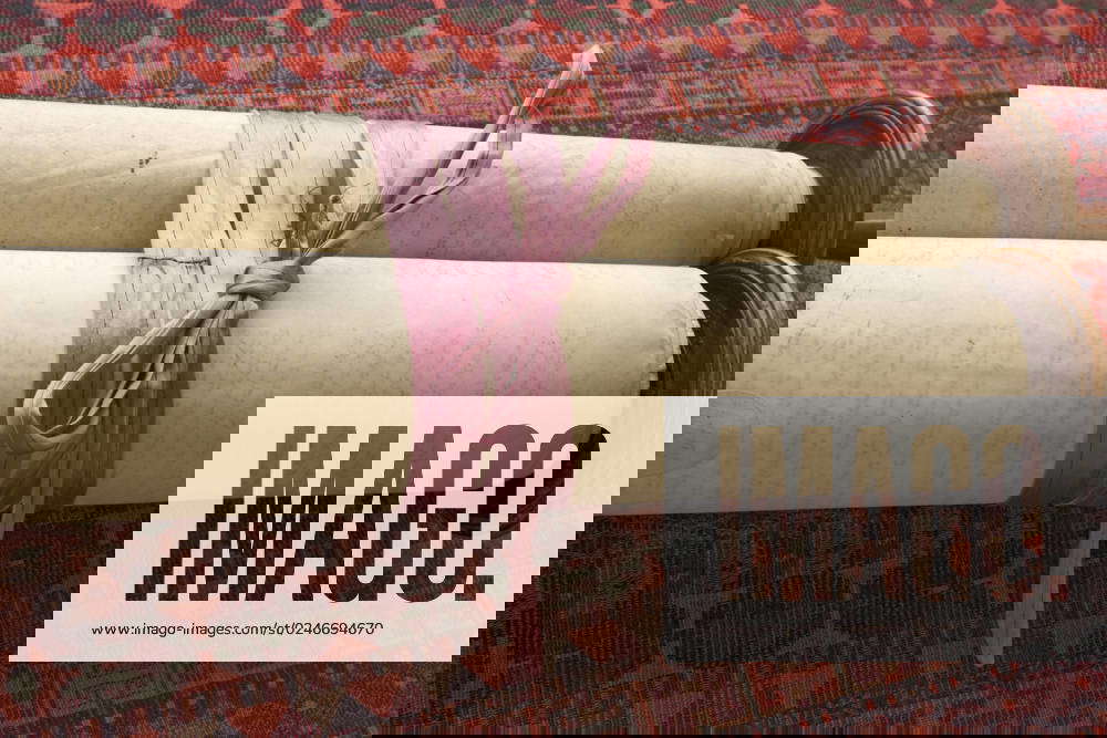 A 150 year-old vintage torah scroll tied with a faded purple ribbon to ...