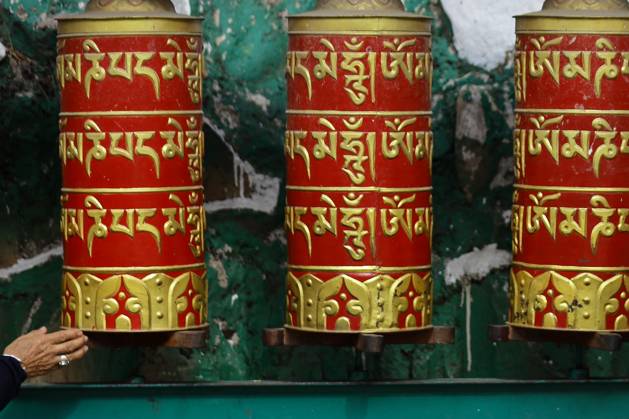 Buddha Jayanti celebration in Nepal A Nepali Buddhism follower rolls ...