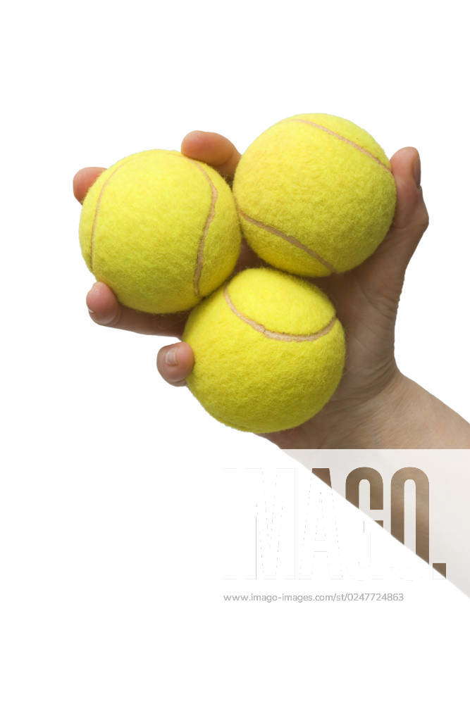 Hand and tennis balls