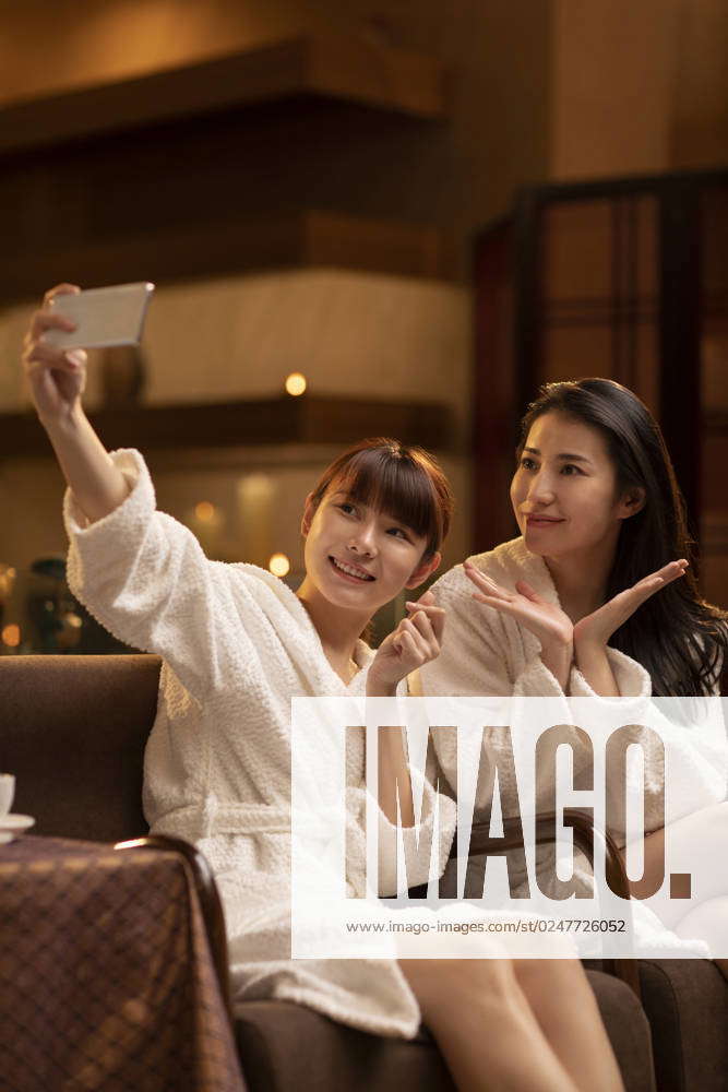 Beautiful young Chinese women relaxing in spa center Beijing China