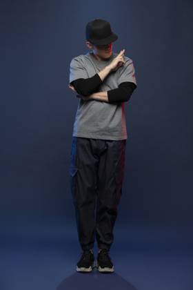 Studio shot of fashionable young Chinese man dancing Beijing China