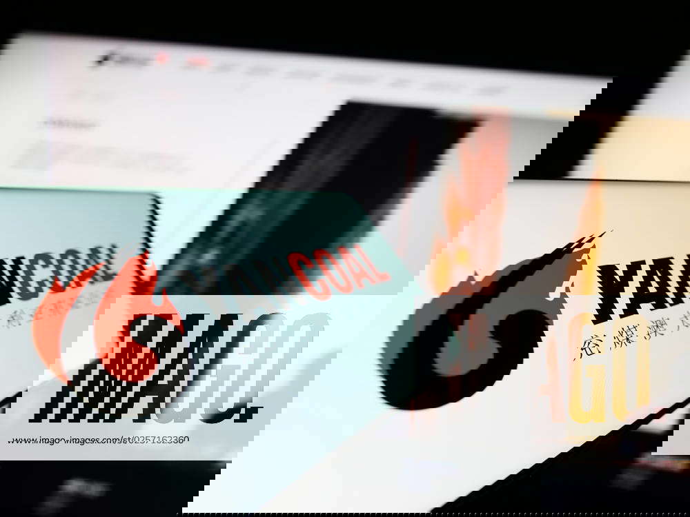 Cellphone with logo of coal mining company Yancoal Australia Limited on ...