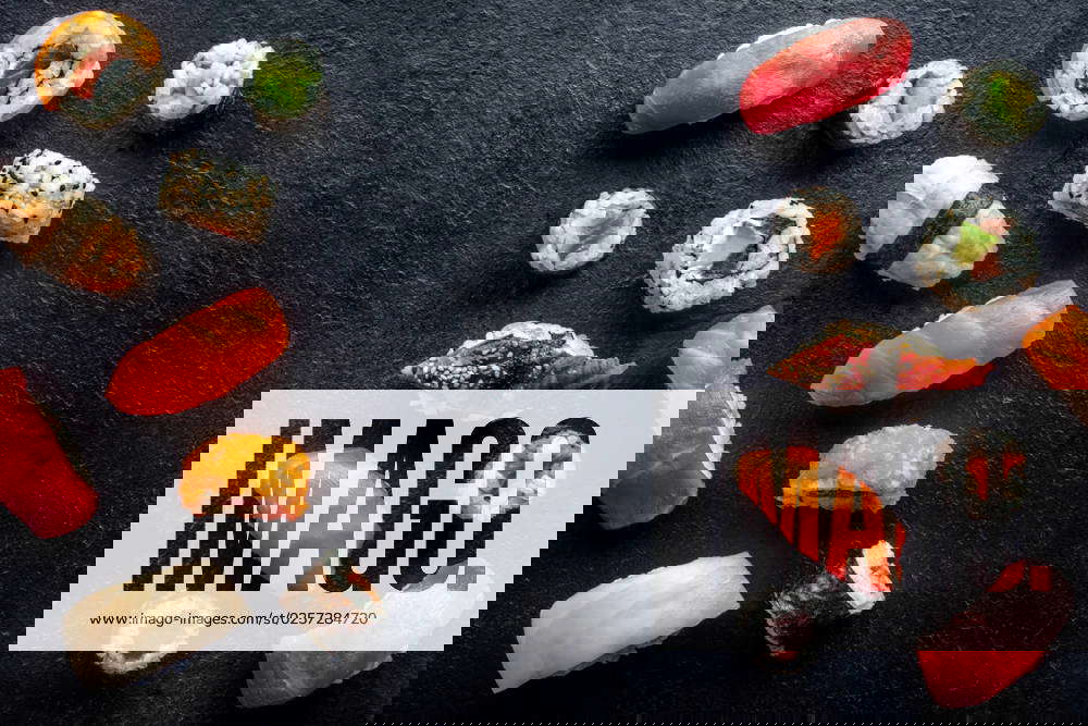 Sushi frame, overhead flat lay shot. Rolls, maki, nigiri on a black ...