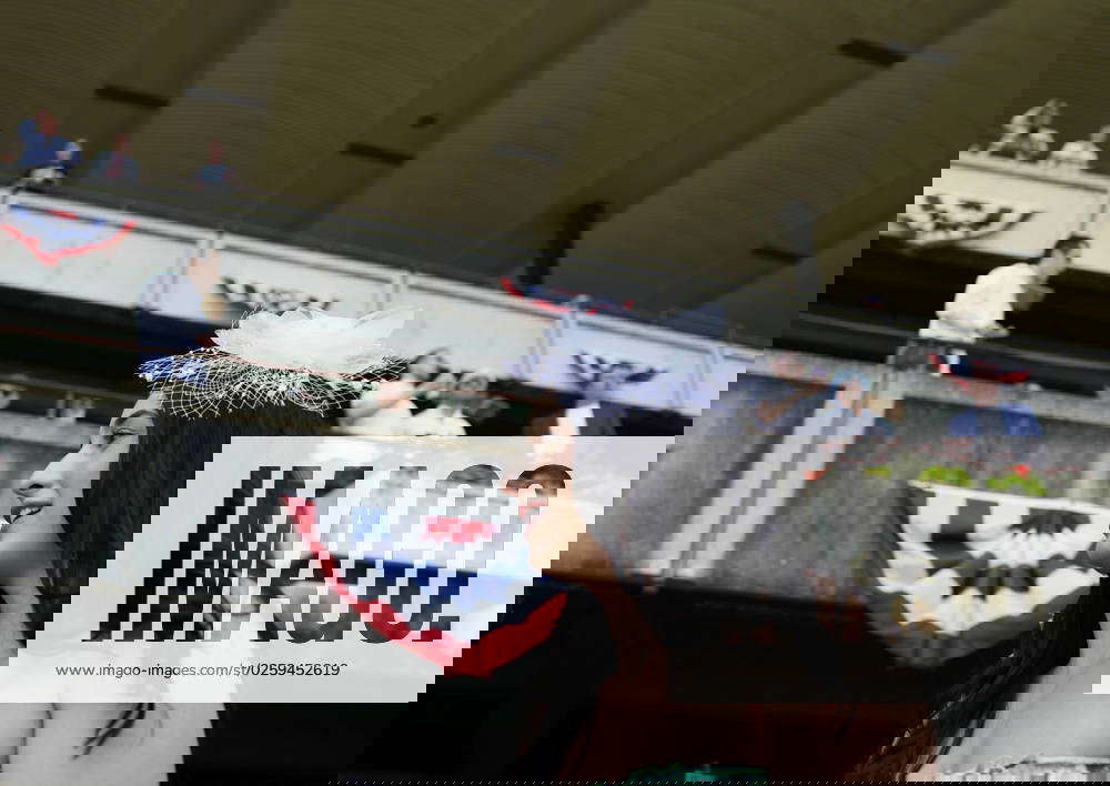 Racing fans wear decorative hats at the 155th running of the Belmont ...