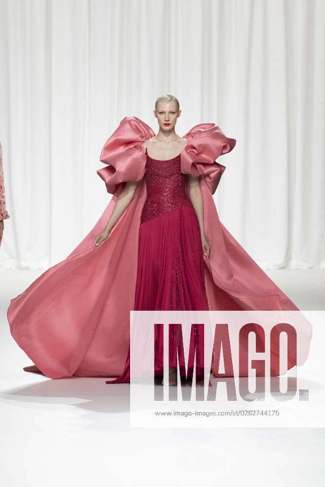 PFW - Rami Al Ali Runway Handout photo shows a model walking the runway ...