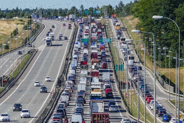 Summer Traffic In Gdansk, Poland Thousands of cars , vans and trucks ...