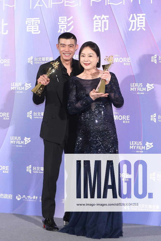 TAIPEI, CHINA - JULY 08: Actor Jacob Wang and actress Lu Hsiao-fen pose with trophies during the