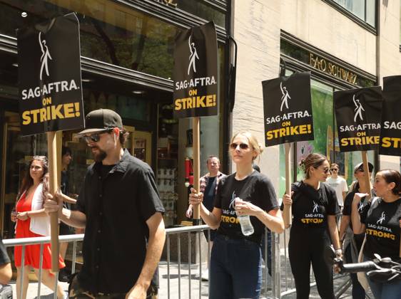 New York City, New York, USA: Picketers hold signs outside NBC Universal during the SAG-AFTRA