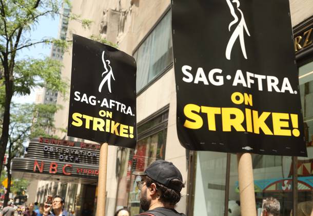 New York City, New York, USA: Picketers hold signs outside NBC Universal during the SAG-AFTRA