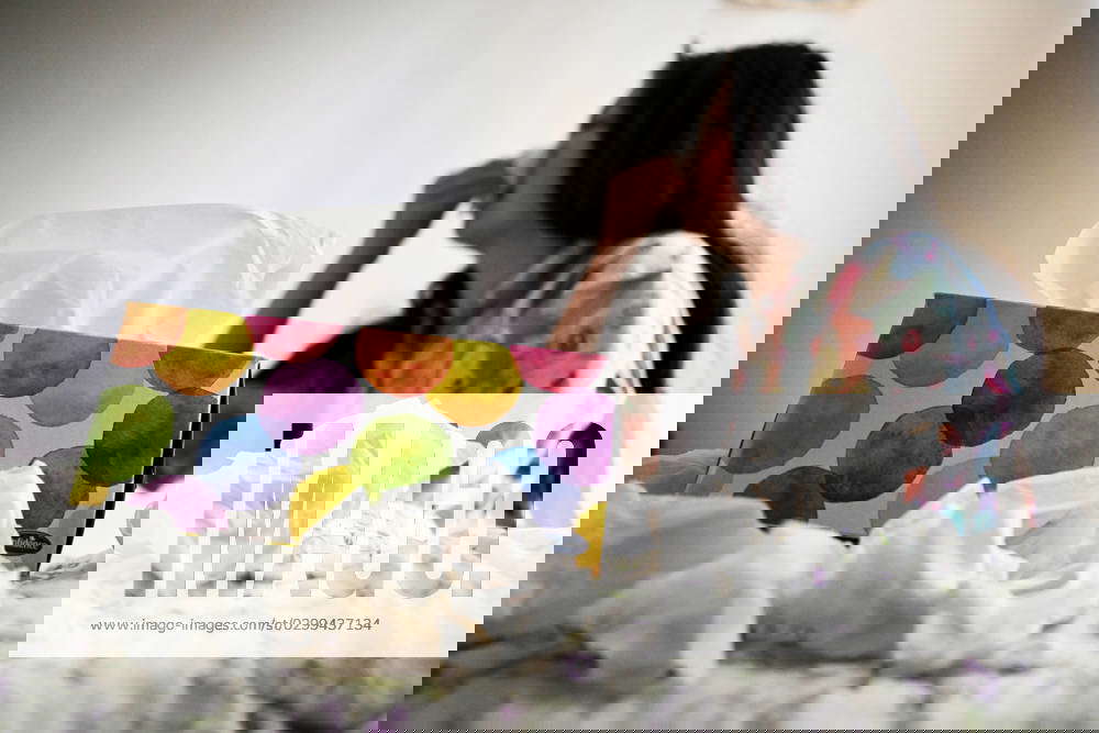 INFLUENZA FLU STOCK, A young woman uses tissues as she recovers from ...