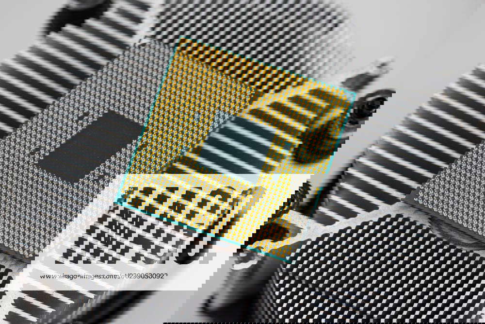 Back of a AMD socket AM4 CPU mounted on a cooler. Back of a AMD socket ...