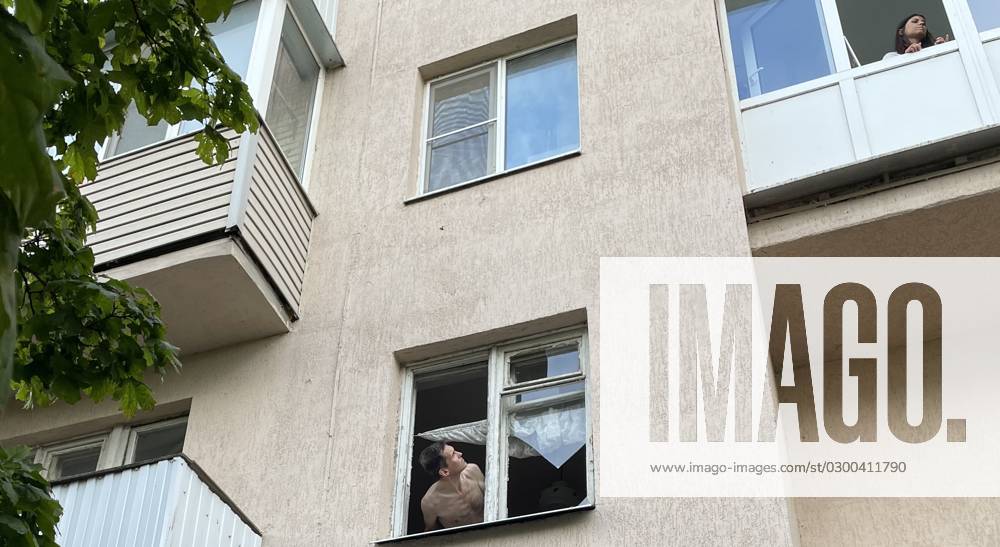 Russia Explosion 8487849 28.07.2023 A man looks out of a broken window ...