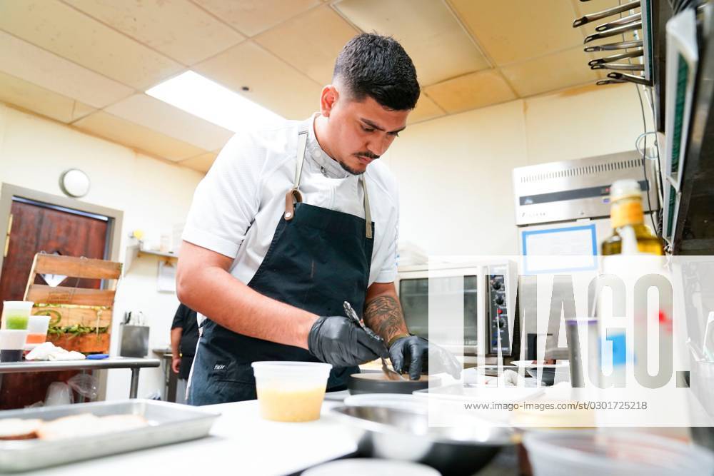 Syndication: The Record Chef Logan Ramirez plates the hamachi crudo in ...