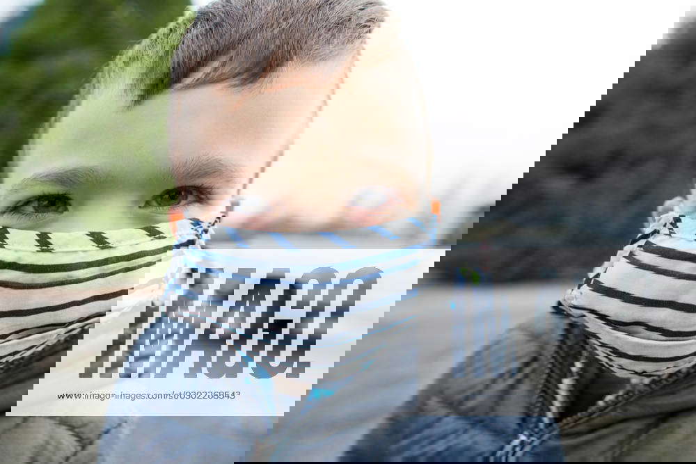 Close up Portrait of young boy wearing mask outdoors Langley, British ...