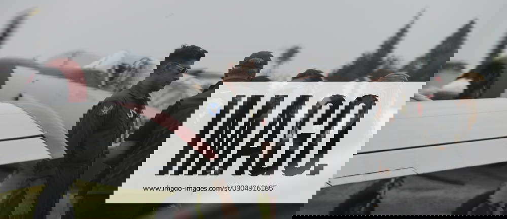 The wife of President Chris Rushing hugs friends at the Condor Squadron ...