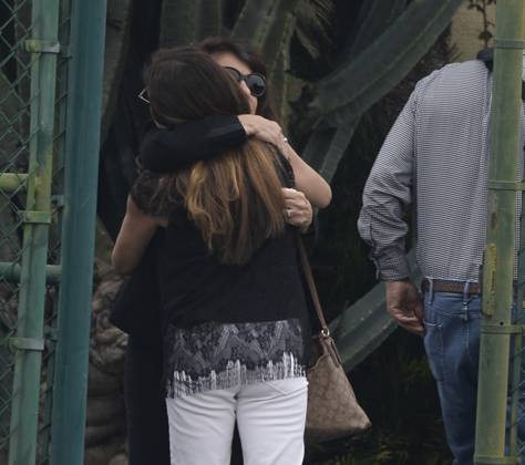 The wife of President Chris Rushing hugs friends at the Condor Squadron ...