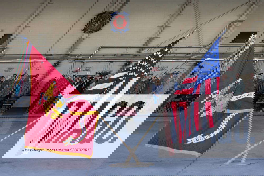 U.S. Marines and Sailors stand at attention during a retirement ...