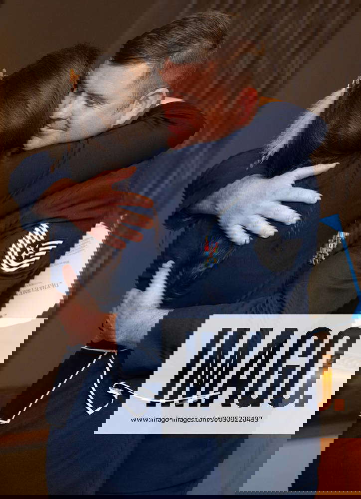 Tech. Sgt. Robert Melcher hugs his wife, Jacqueline, director of the ...