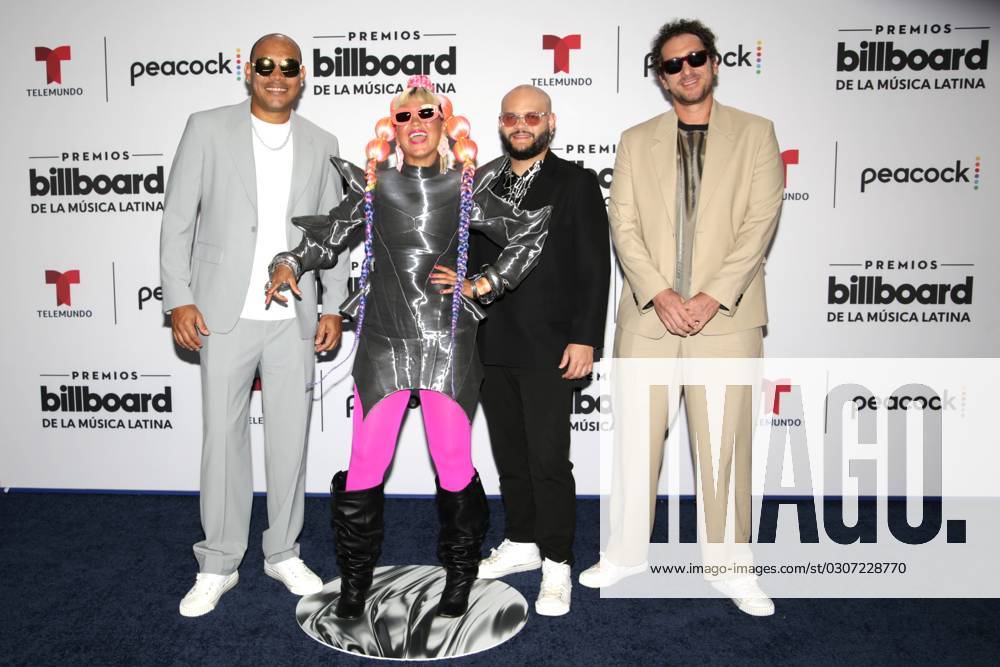 Colombian band Bomba Estereo members pose on the blue carpet at the ...