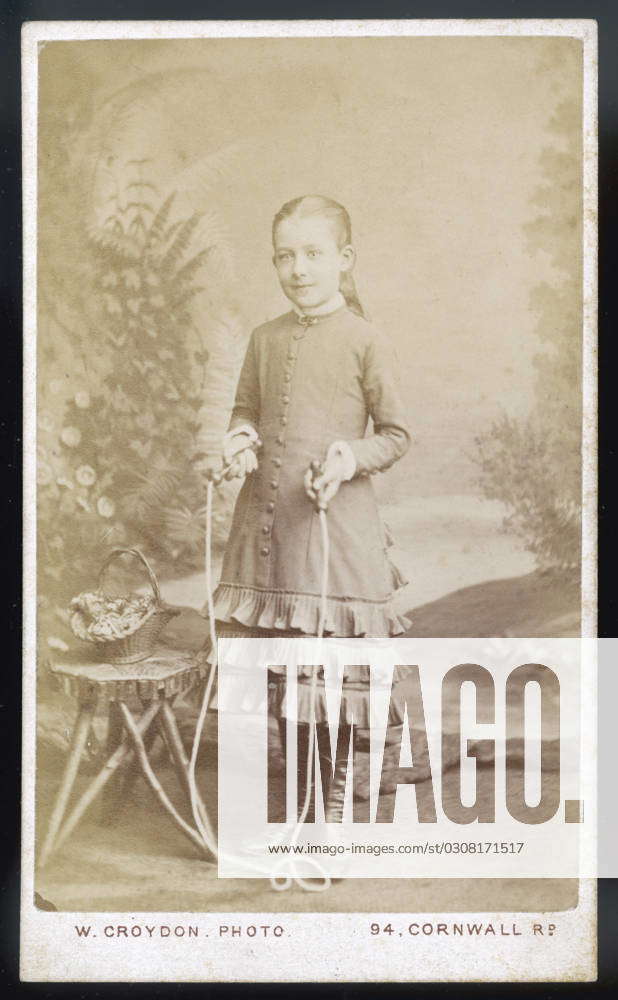 GIRL WITH SKIPPING ROPE A young Victorian girl poses for the camera ...