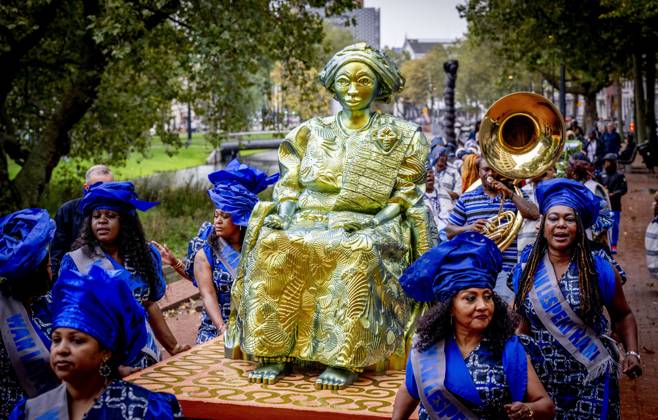 ROTTERDAM - The statue of Winti goddess Mama Aisa is carried in a ...