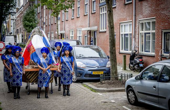 ROTTERDAM - The statue of Winti goddess Mama Aisa is carried in a ...