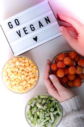 Lightbox with text GO VEGAN Three Bowls of frozen vegetables food of ...