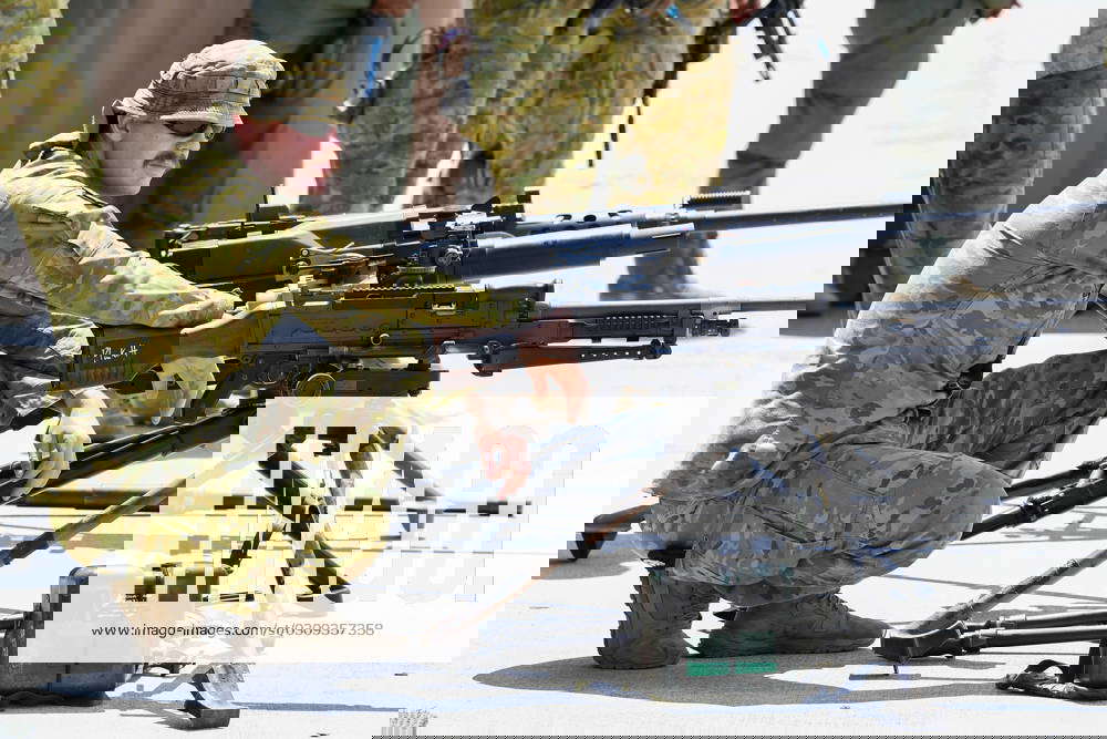 FIJI PM BUSHMASTER, An Australian soldier looks on as Bushmasters are ...