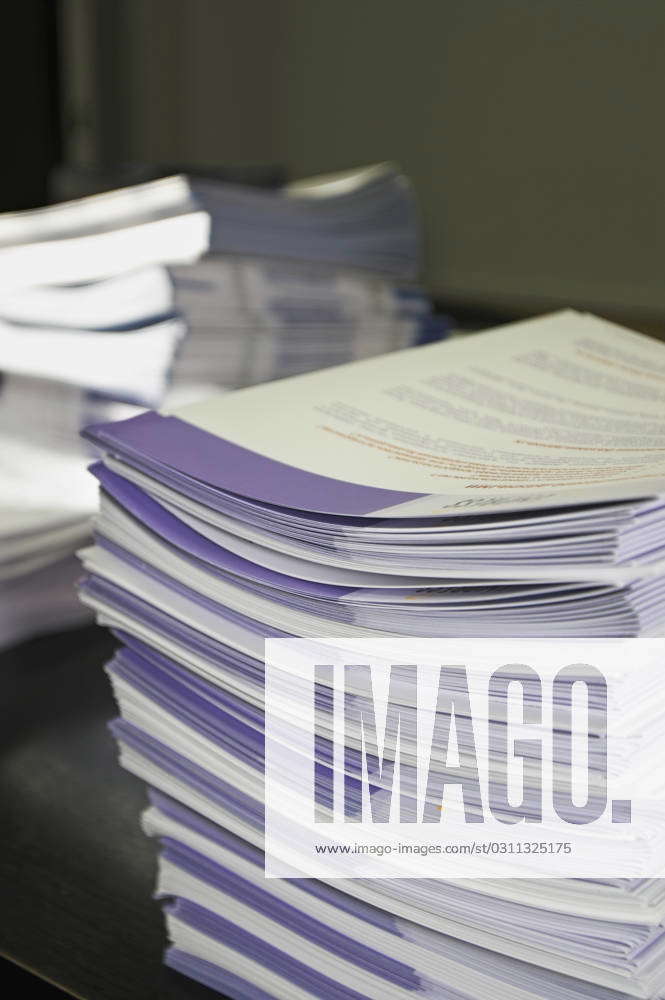 Piles of handout papers lying on a table. , 1024736, outlets, books ...