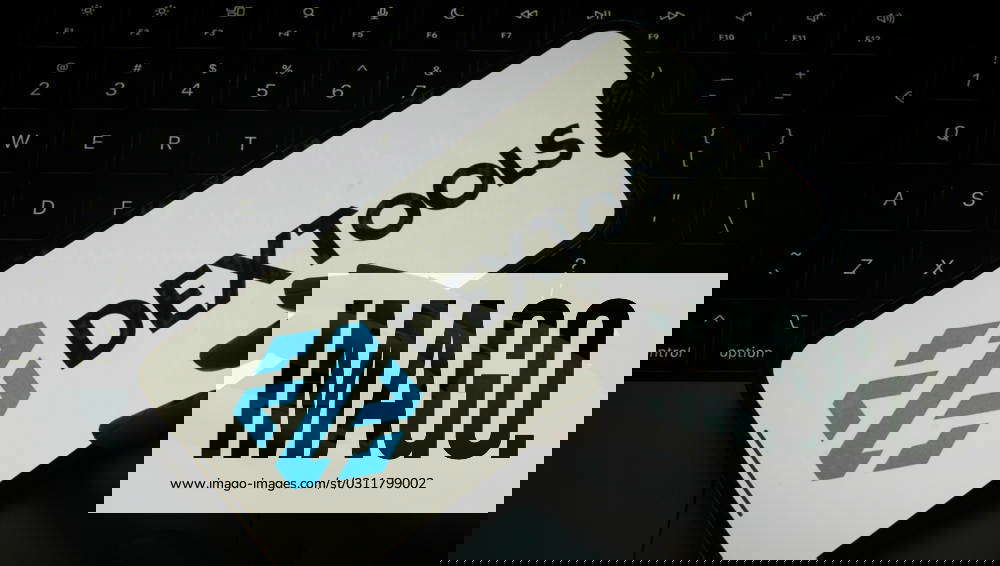 Tech Illustrations DEXTools logo is seen on the screen of a mobile ...