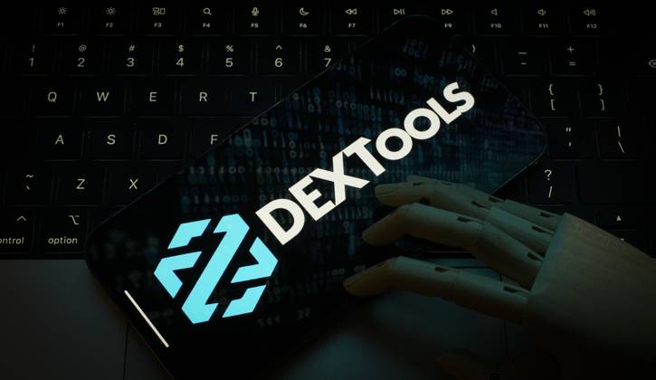 Tech Illustrations DEXTools logo is seen on the screen of a mobile ...