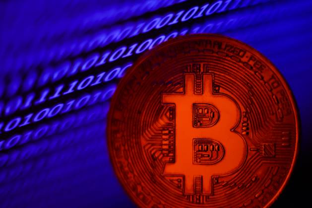 Bitcoin And Ethereum Photo Illustrations A binary code displayed on a ...