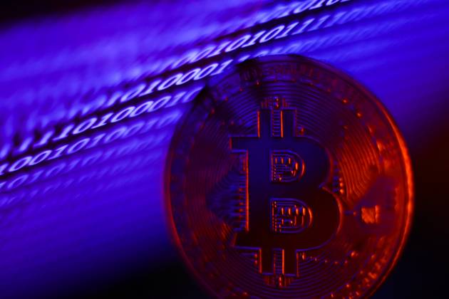 Bitcoin And Ethereum Photo Illustrations A binary code displayed on a ...