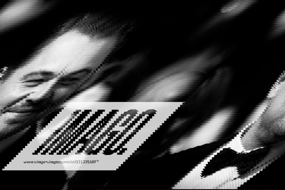 Leonardo DiCaprio waits to walk on the red carpet for Once Upon a Time ...