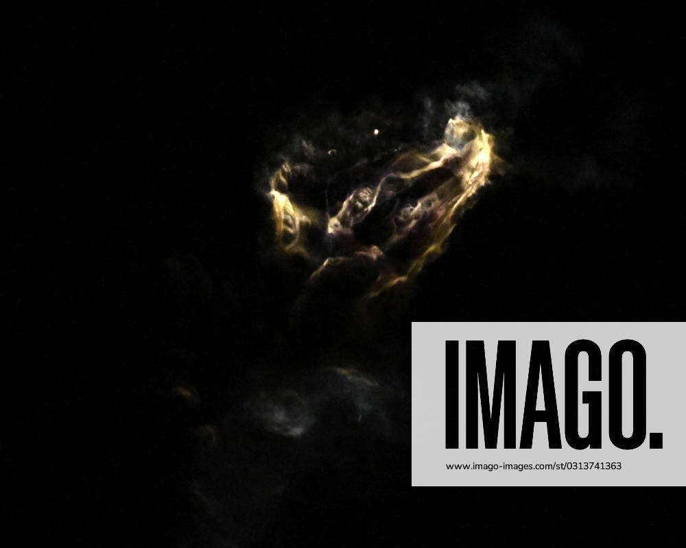 Exhaust plume is illuminated as the SpaceX Falcon 9 rocket stage ...