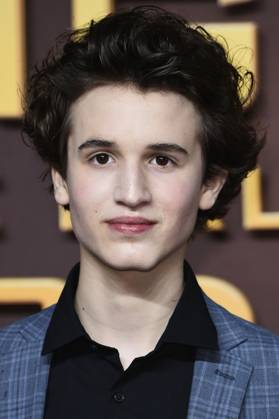 Max Raphael at the premiere of the movie The Hunger Games The Ballad of ...