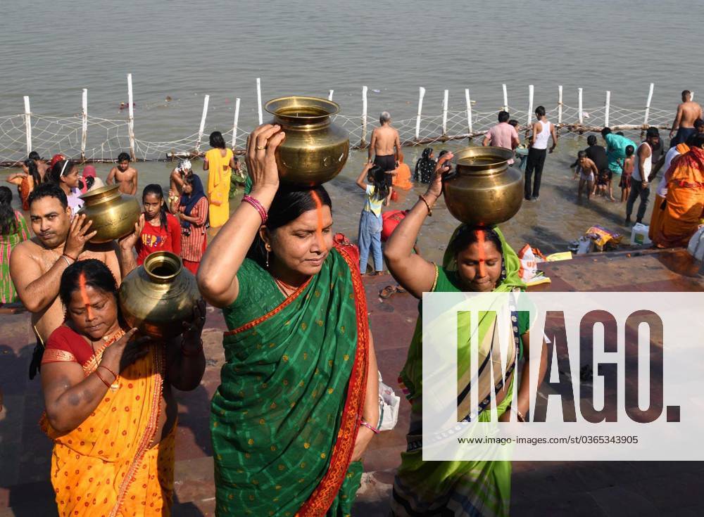 PATNA, INDIA - NOVEMBER 17: Chhath devotees carrying Ganga water at ...