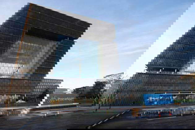 The corporate headquarters of ThyssenKrupp in Essen, company logo ...